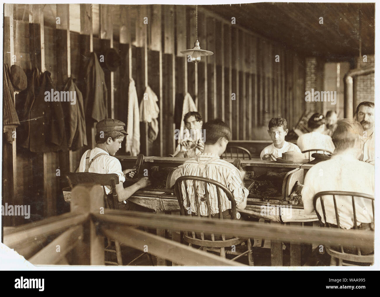 Cigarmakers in factory of Filogamo & Alvarez, Tampa, Fla. Work was ...