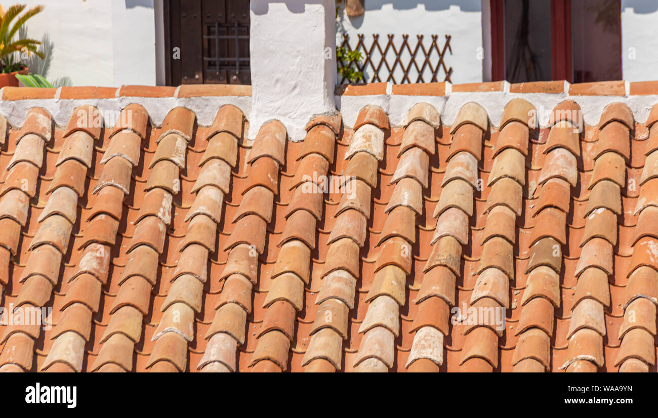 Traditional old Spanish ceramic roof tiles on a building ...