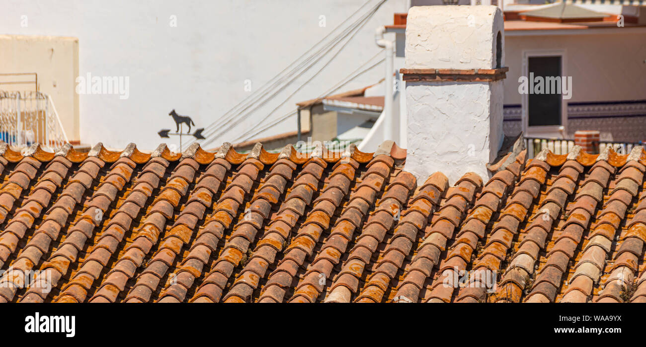 Traditional old Spanish ceramic roof tiles on a building ...