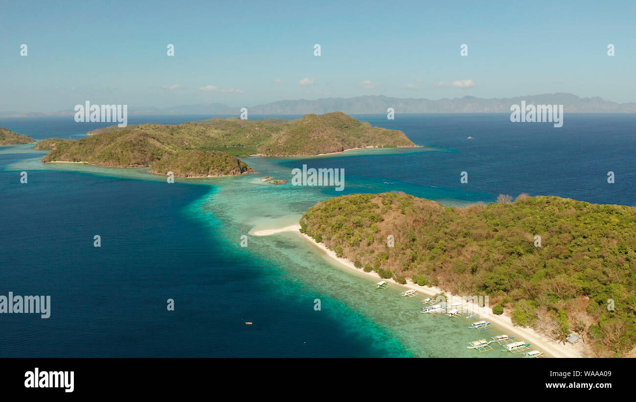 aerial view tropical islands with blue lagoon, coral reef and sandy ...