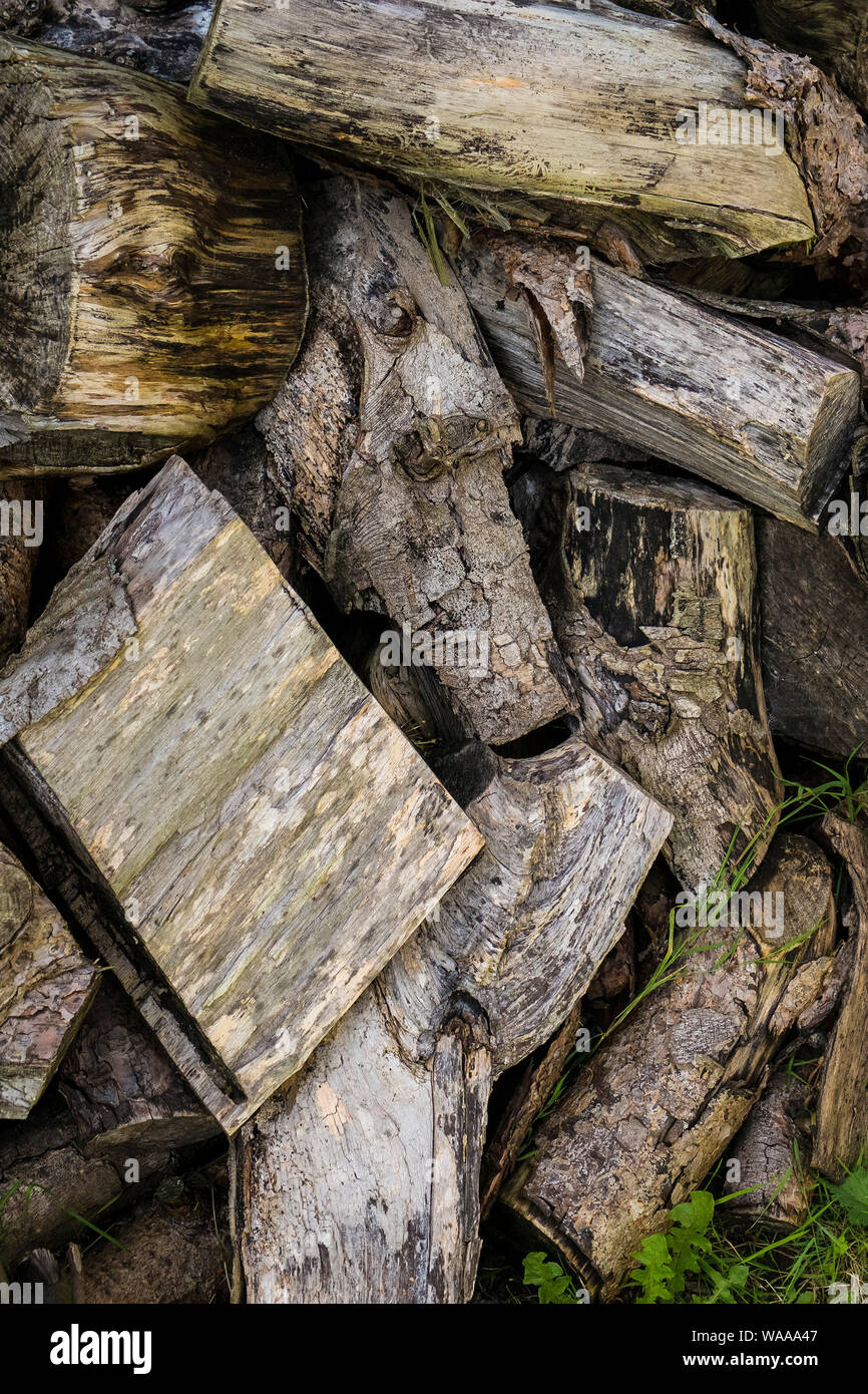 A stack pile of chopped logs used for firewood Stock Photo - Alamy