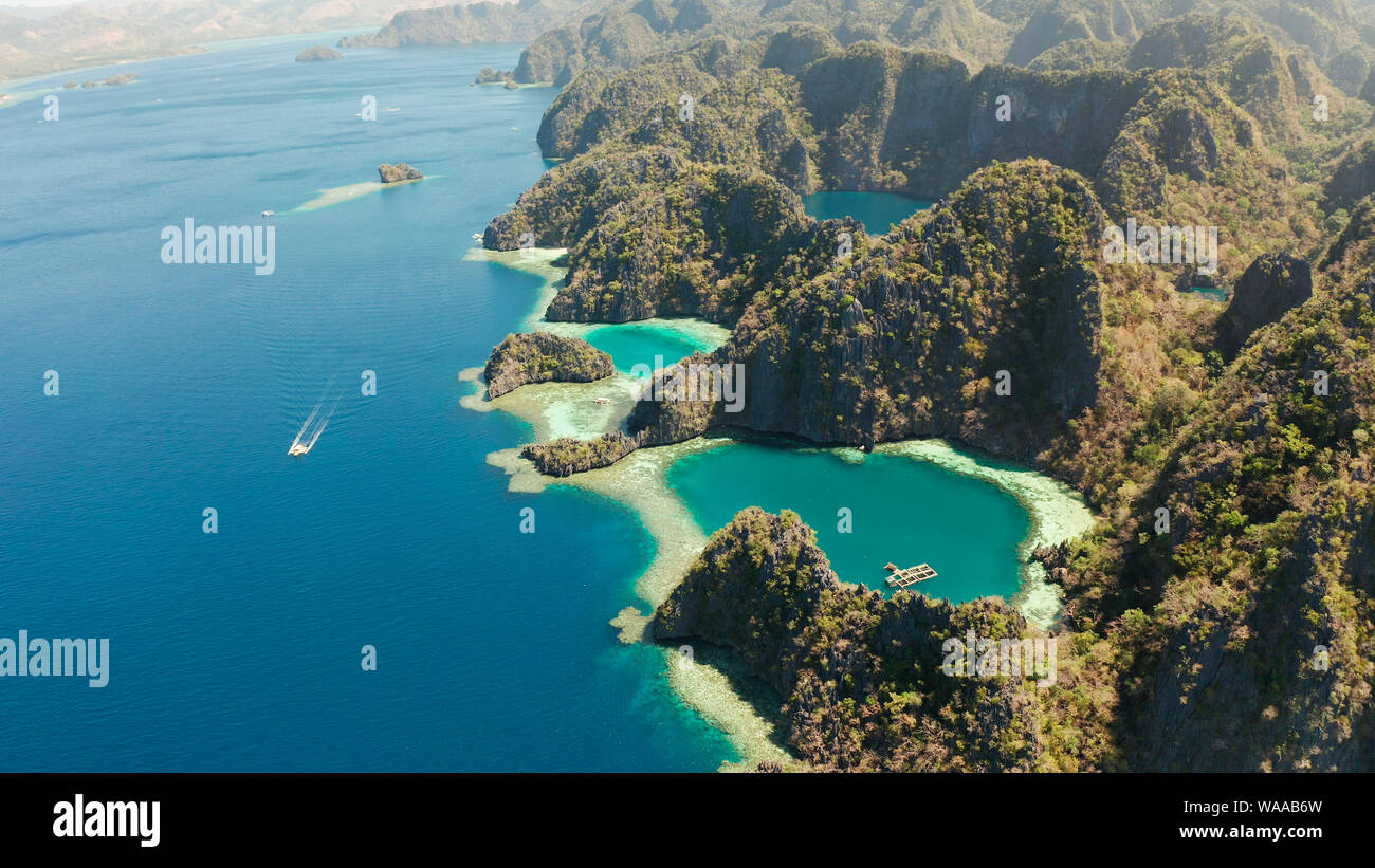 Tourist boats around the beautiful big and small lagoons, aerial view ...