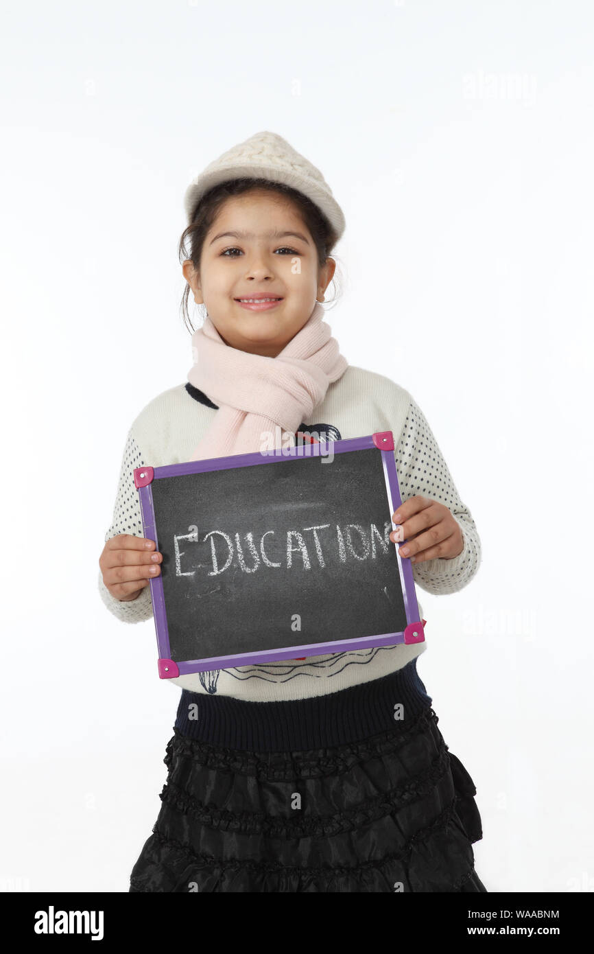 Happy children holding slate hi-res stock photography and images - Alamy