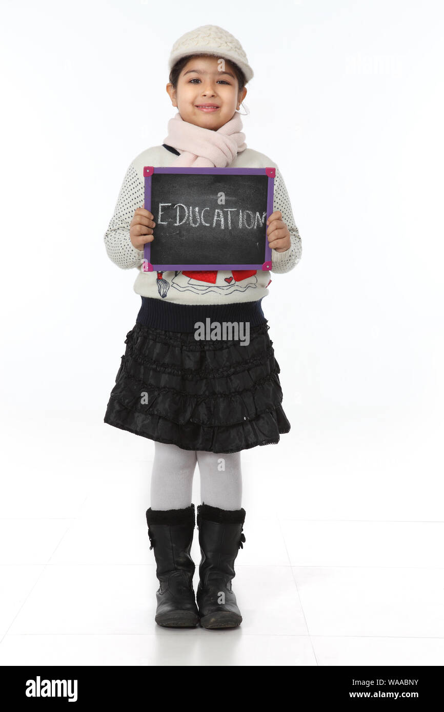 Happy children holding slate hi-res stock photography and images - Alamy