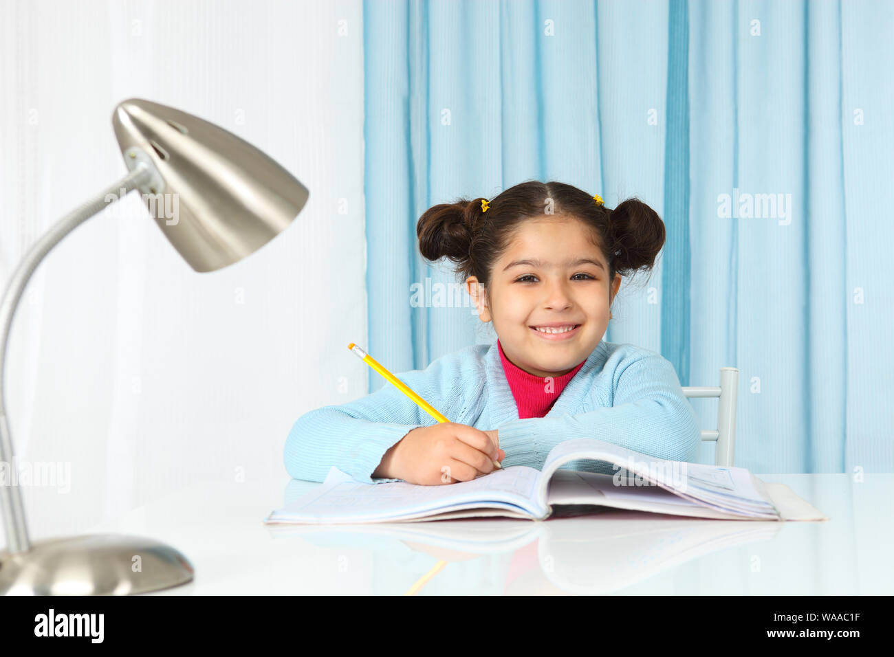 Indian girl doing homework hi-res stock photography and images - Alamy