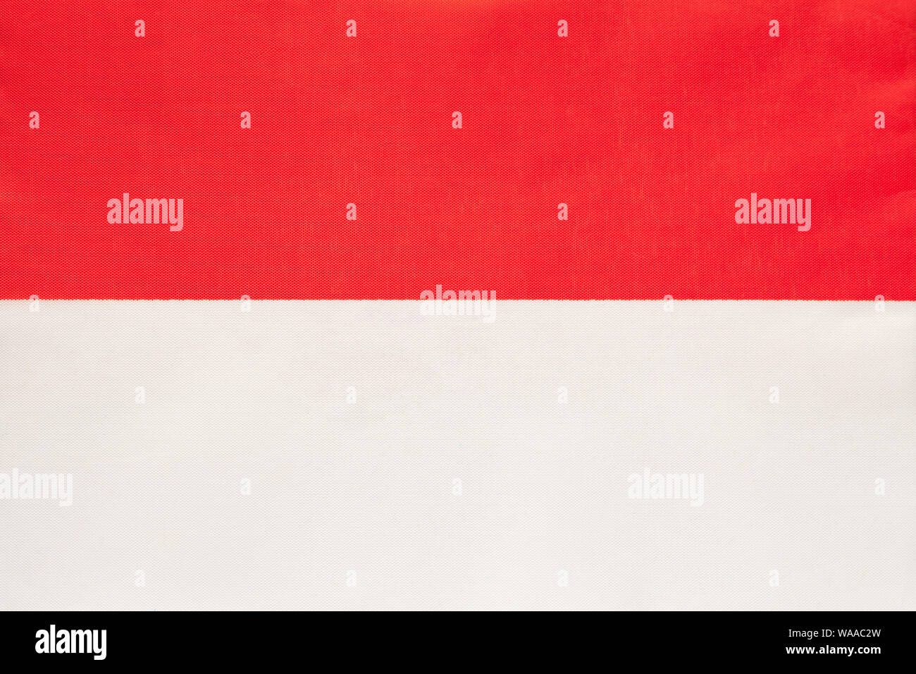 Monaco national fabric flag, textile background. Symbol of ...