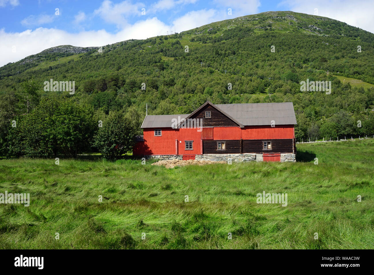 Red wooden farm house in Norway Stock Photo - Alamy