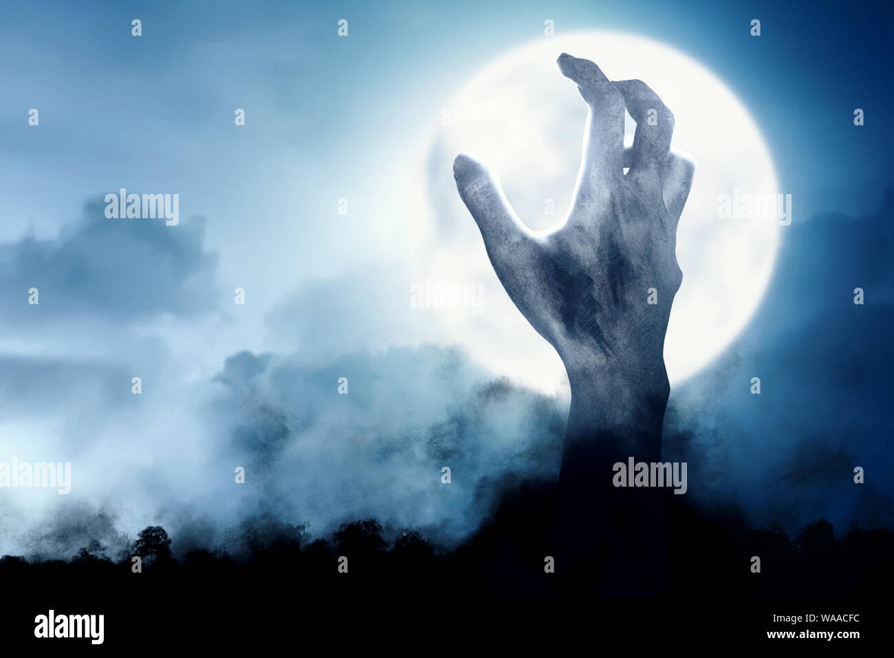 Rise of zombies hand from the ground at night. Halloween concept Stock ...