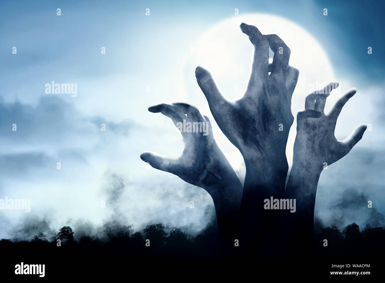 Rise of zombies hand from the ground at night. Halloween concept Stock ...