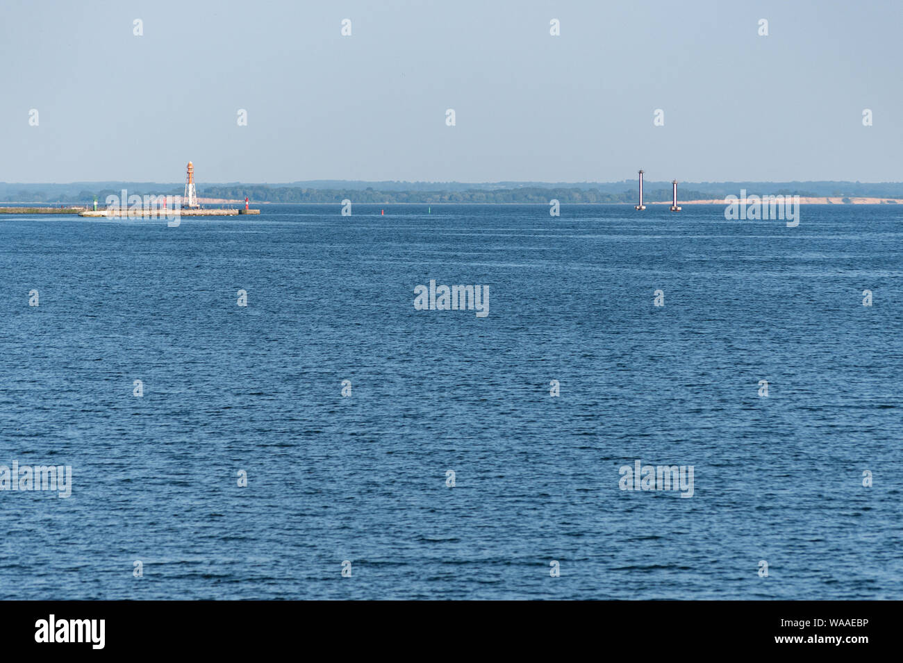 Jetty with towers and buoys. Beautiful seascape, copy space. Breakwater ...