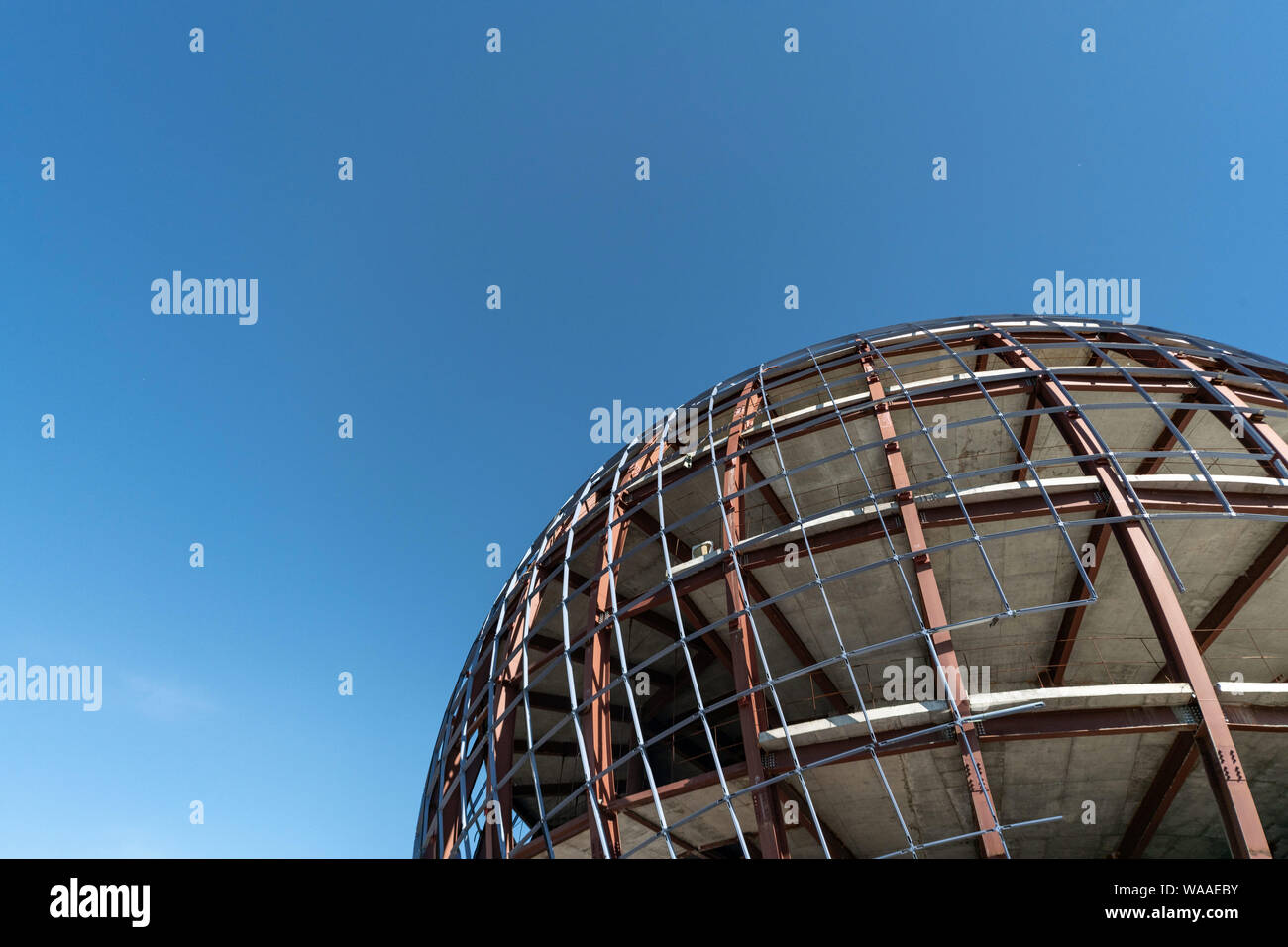 Unfinished sphere shape building, copy space. Construction of ...
