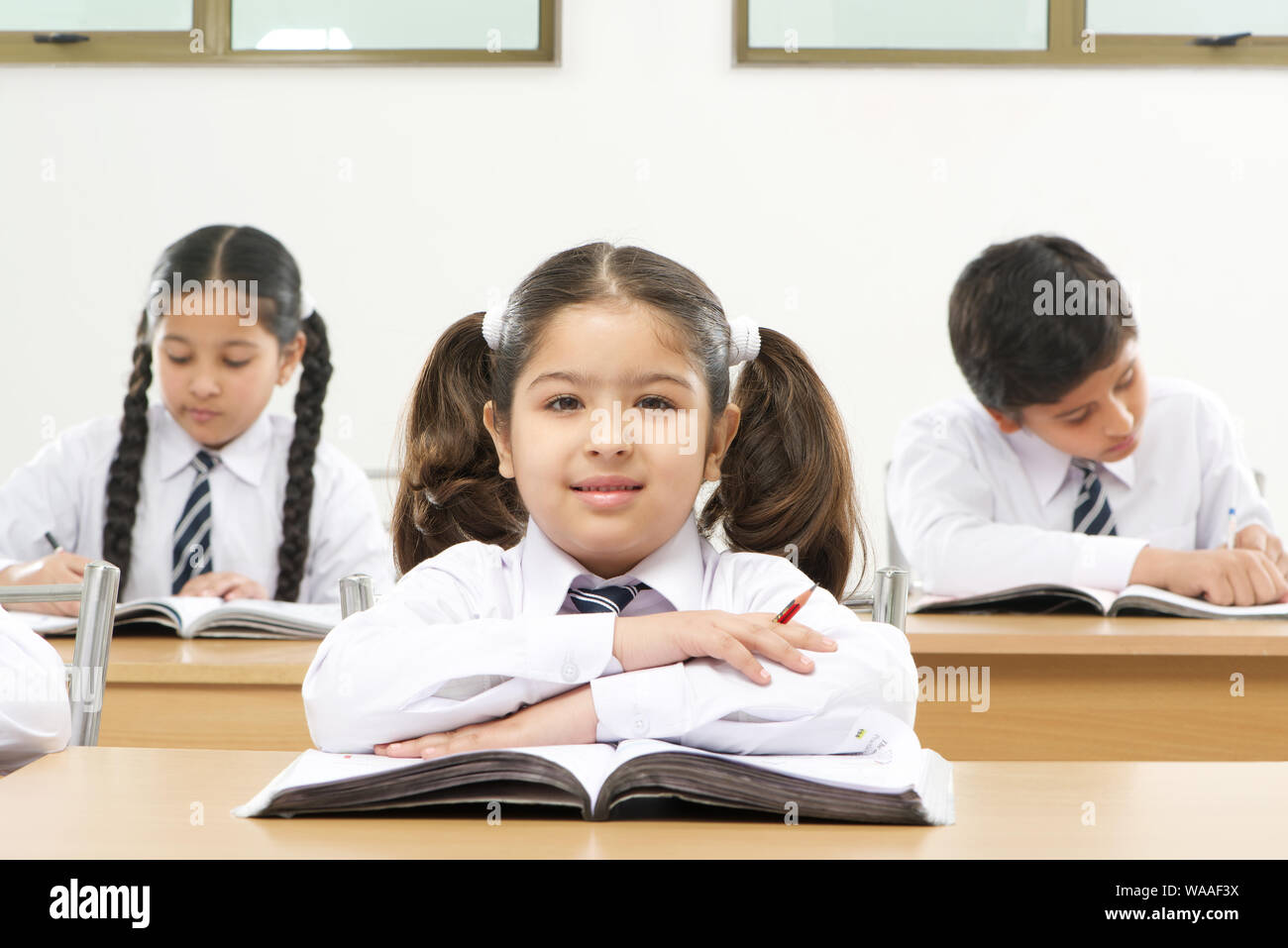 School children studying in a classroom Stock Photo - Alamy