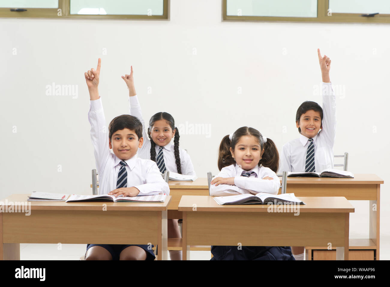 School children studying in a classroom Stock Photo - Alamy