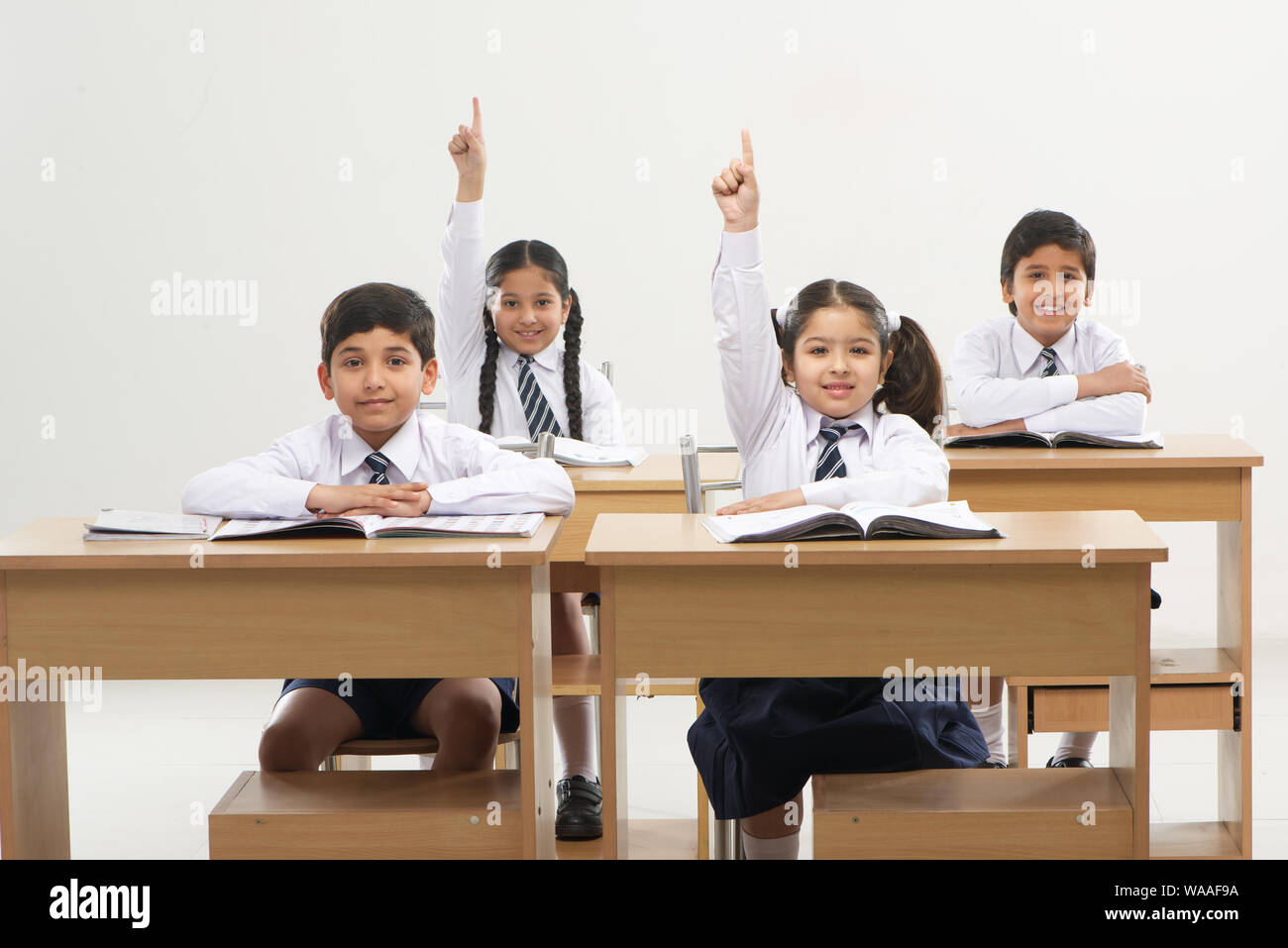 School children studying in a classroom Stock Photo - Alamy