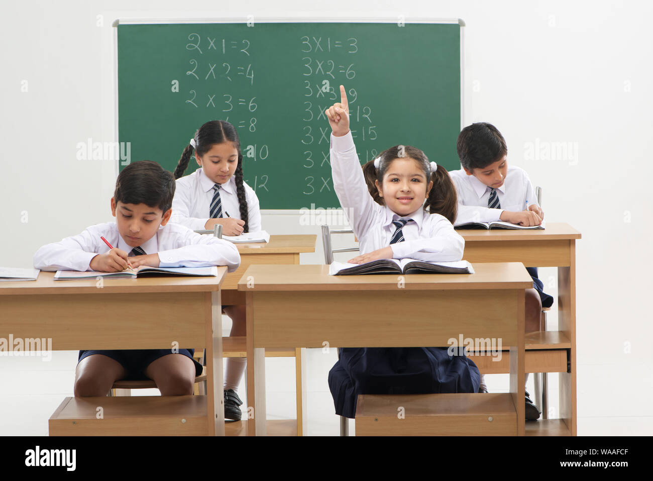 School children studying in a classroom Stock Photo - Alamy