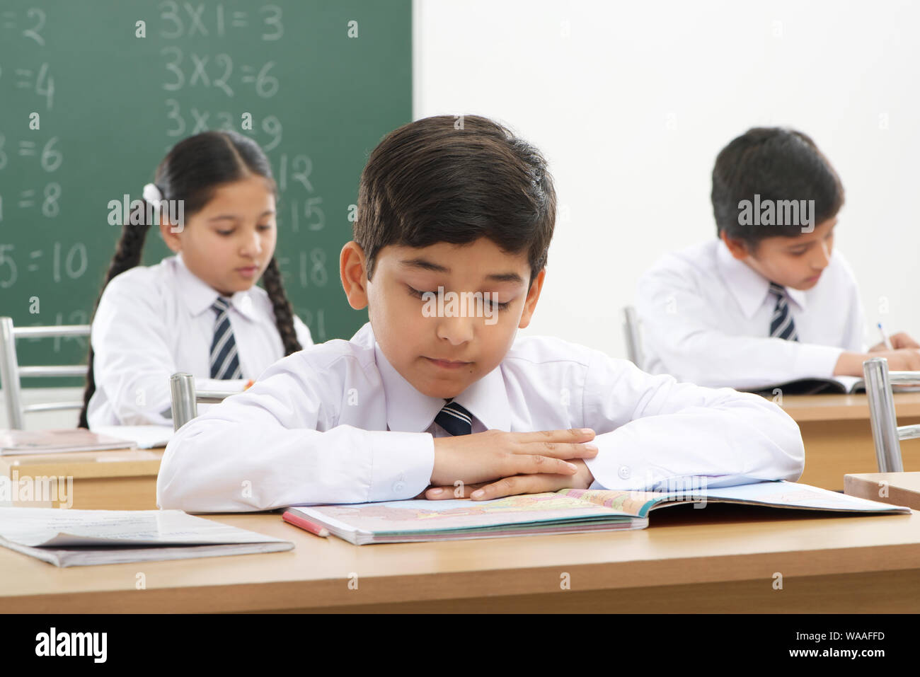 School children studying in a classroom Stock Photo - Alamy