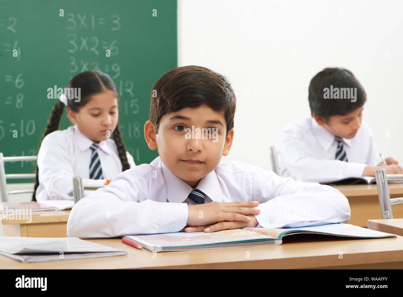 School children studying in a classroom Stock Photo - Alamy