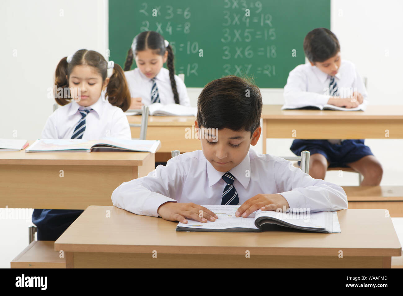 School children studying in a classroom Stock Photo - Alamy