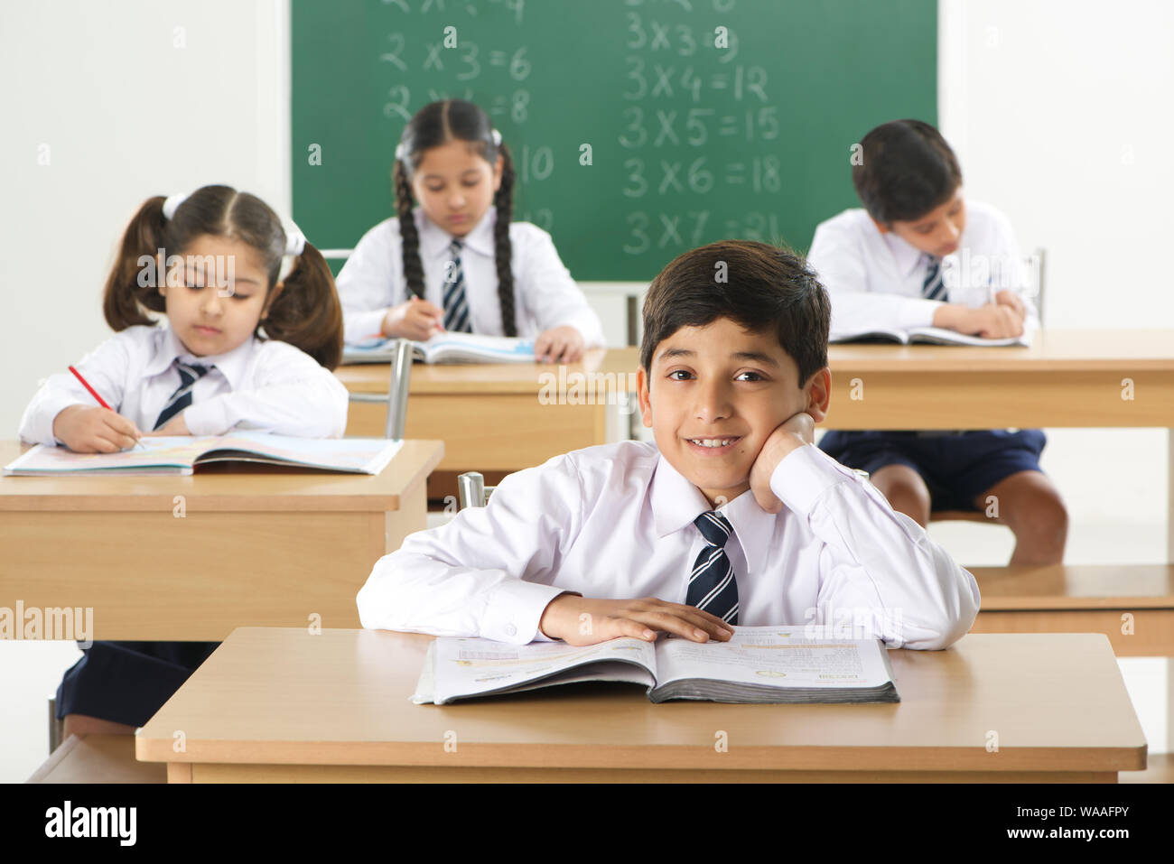 School children studying in a classroom Stock Photo - Alamy