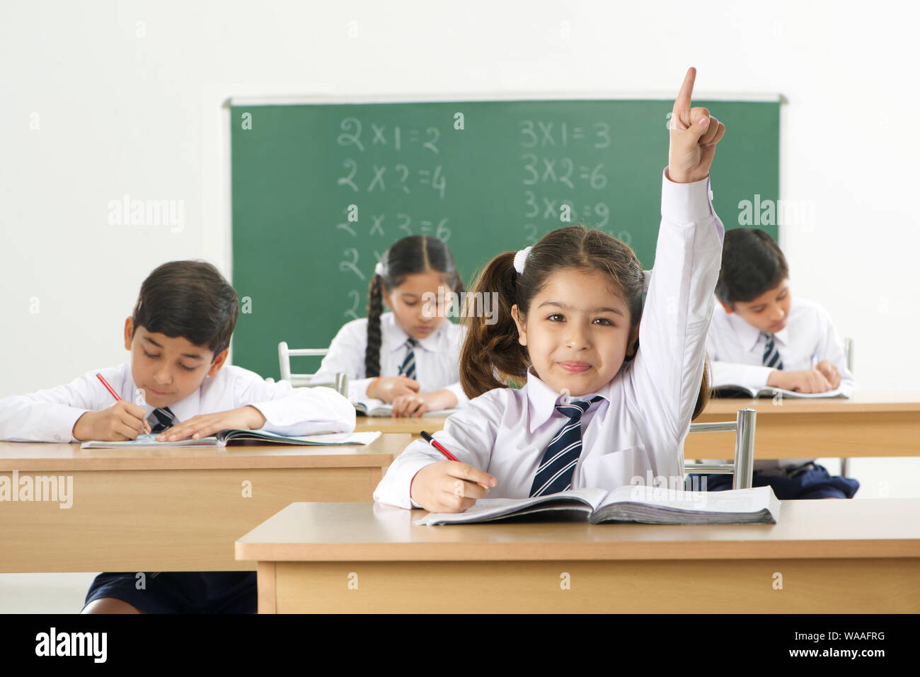School children studying in a classroom Stock Photo - Alamy