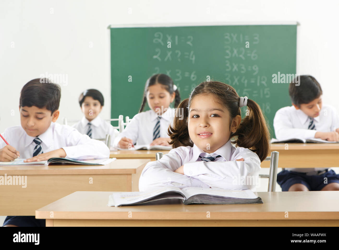 School children studying in a classroom Stock Photo - Alamy