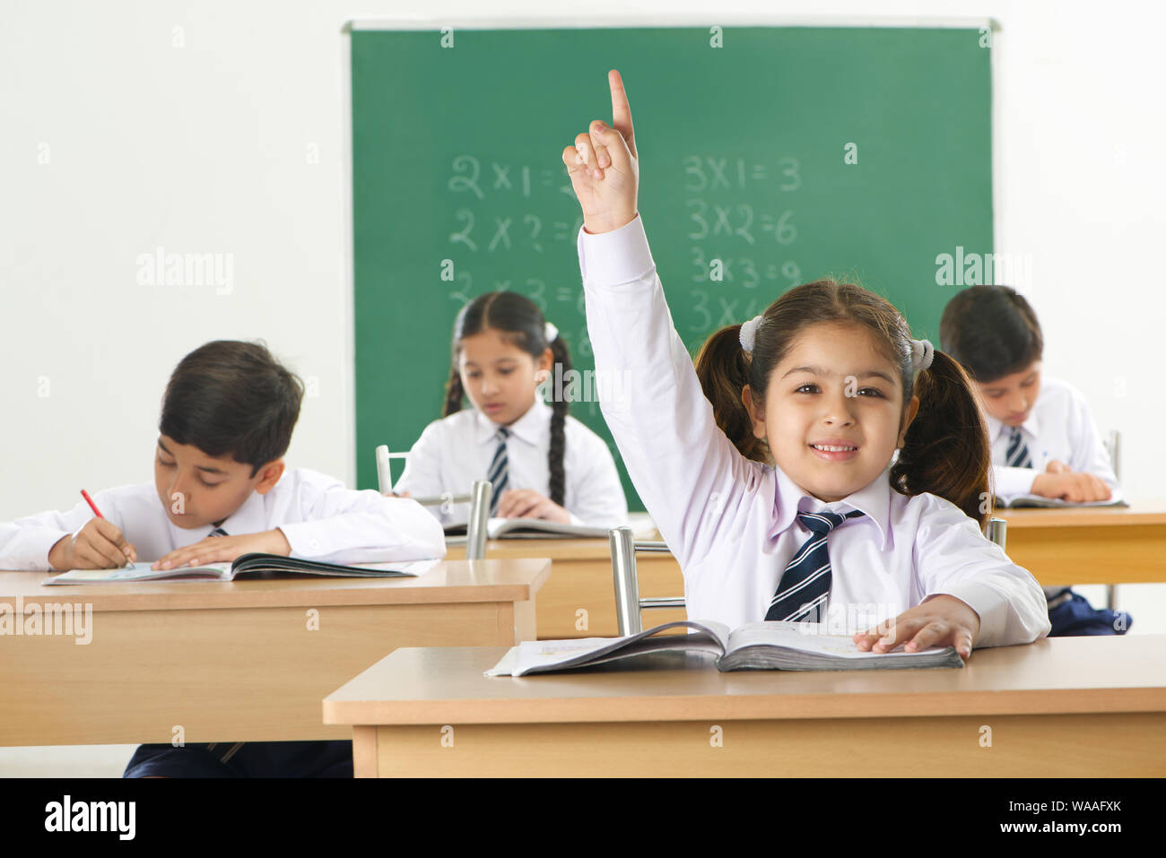 School children studying in a classroom Stock Photo - Alamy
