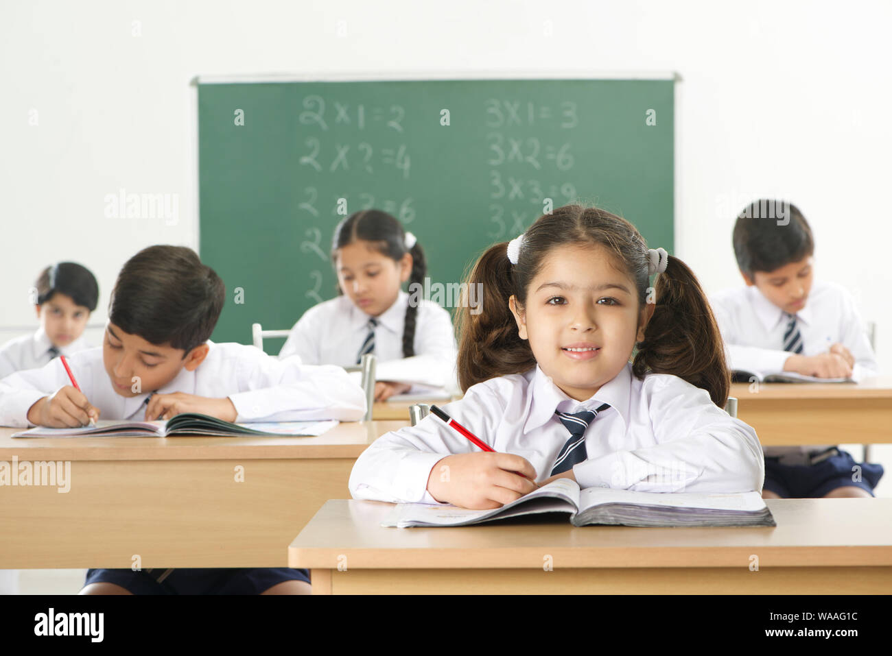 School children studying in a classroom Stock Photo - Alamy