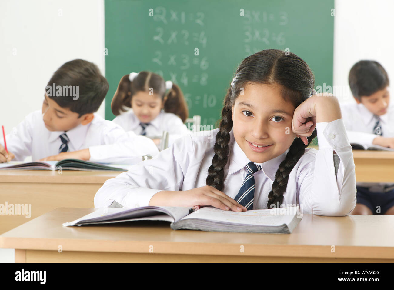 School children studying in a classroom Stock Photo - Alamy