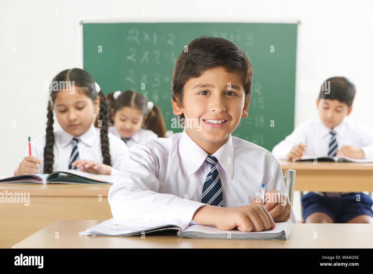 School children studying in a classroom Stock Photo - Alamy