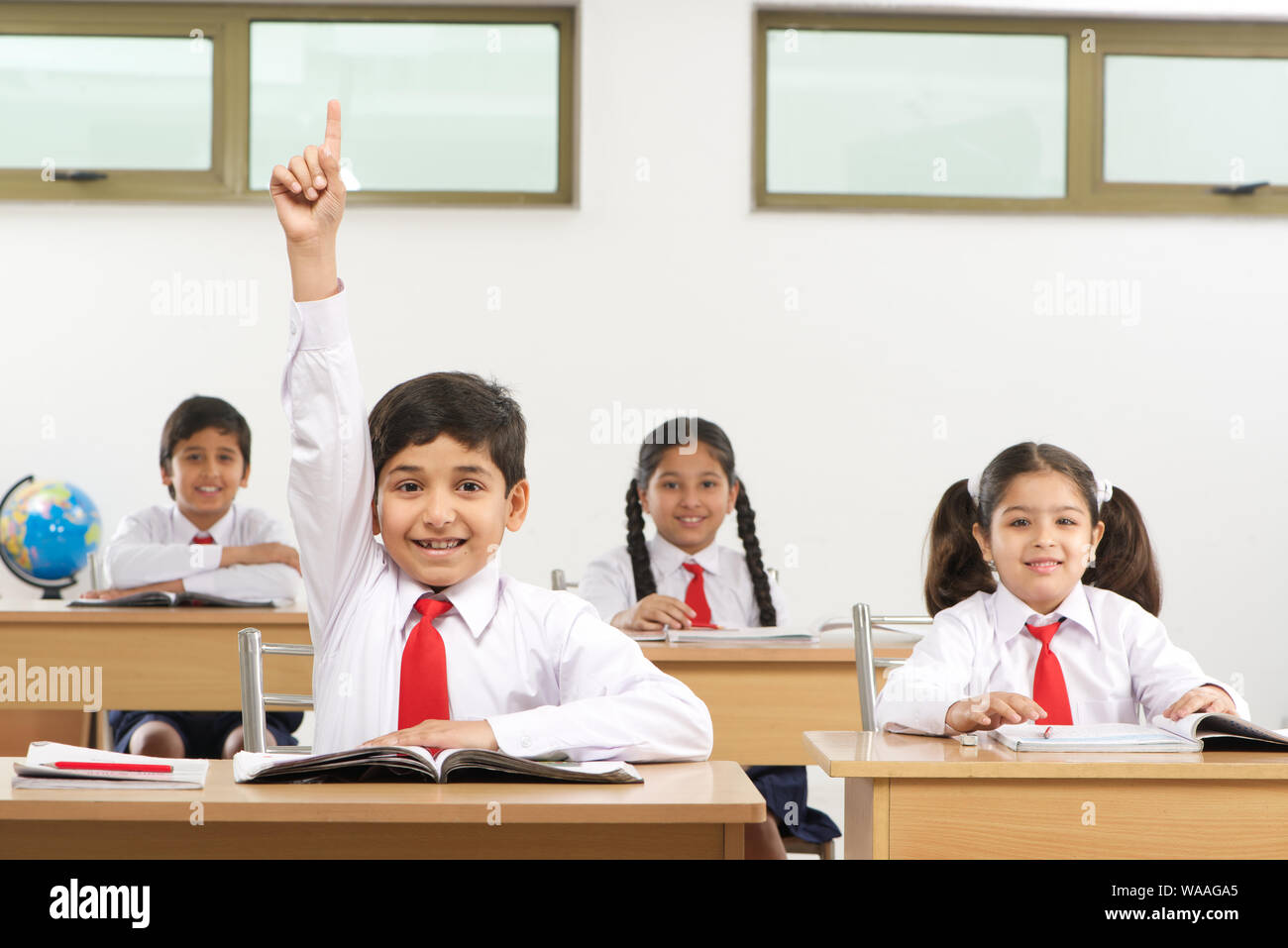 School children studying in a classroom Stock Photo - Alamy
