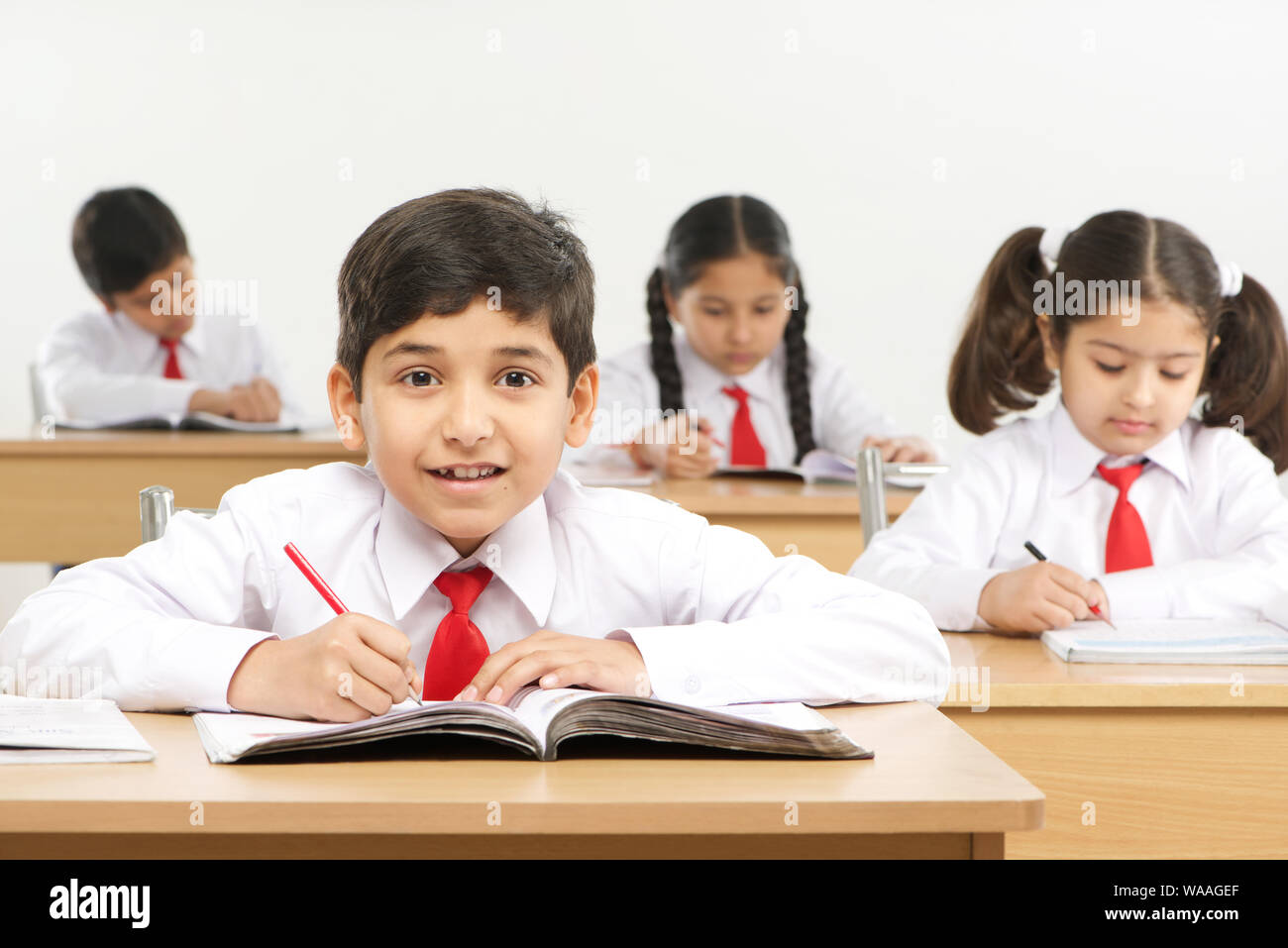 School children studying in a classroom Stock Photo - Alamy