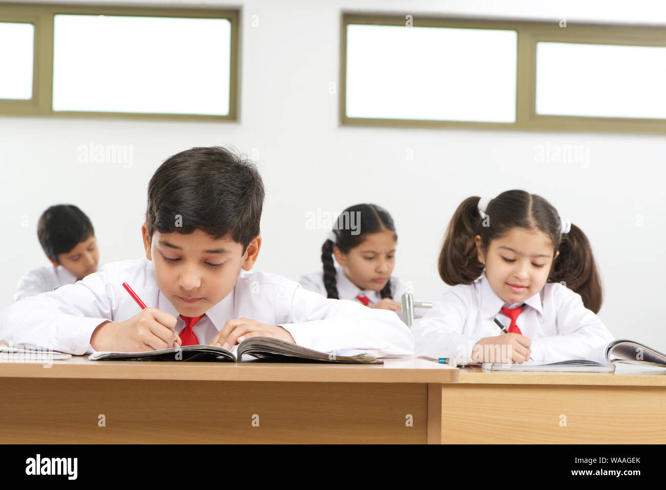 School children studying in a classroom Stock Photo - Alamy