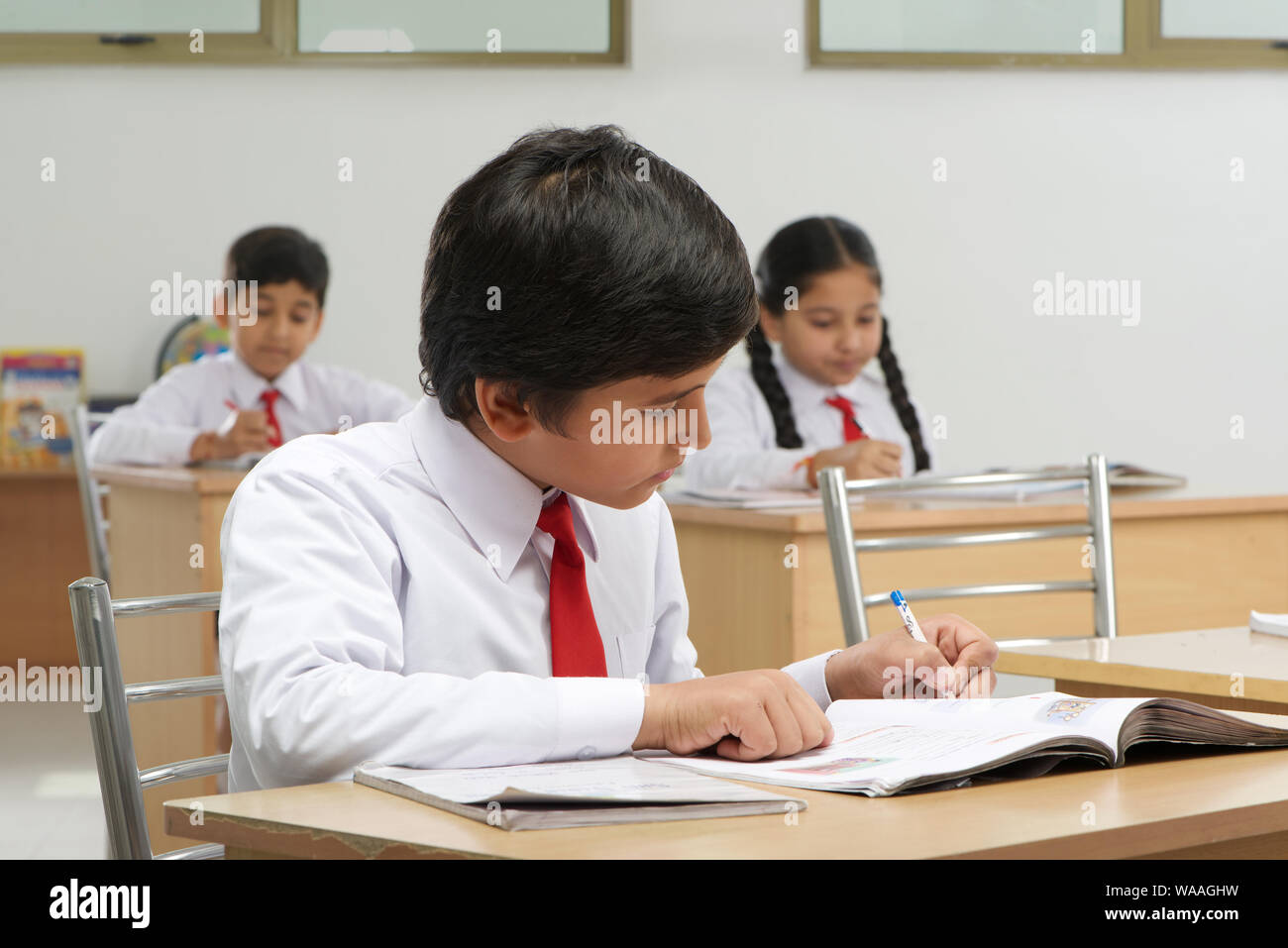 School children studying in a classroom Stock Photo - Alamy