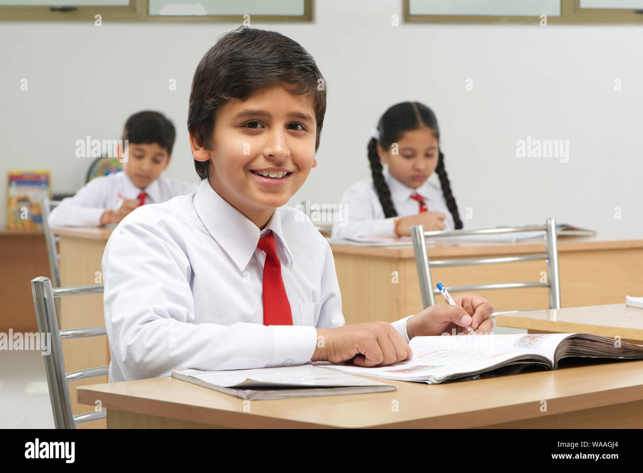 School children studying in a classroom Stock Photo - Alamy