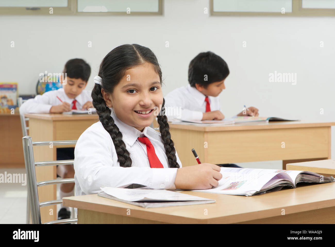 School children studying in a classroom Stock Photo - Alamy