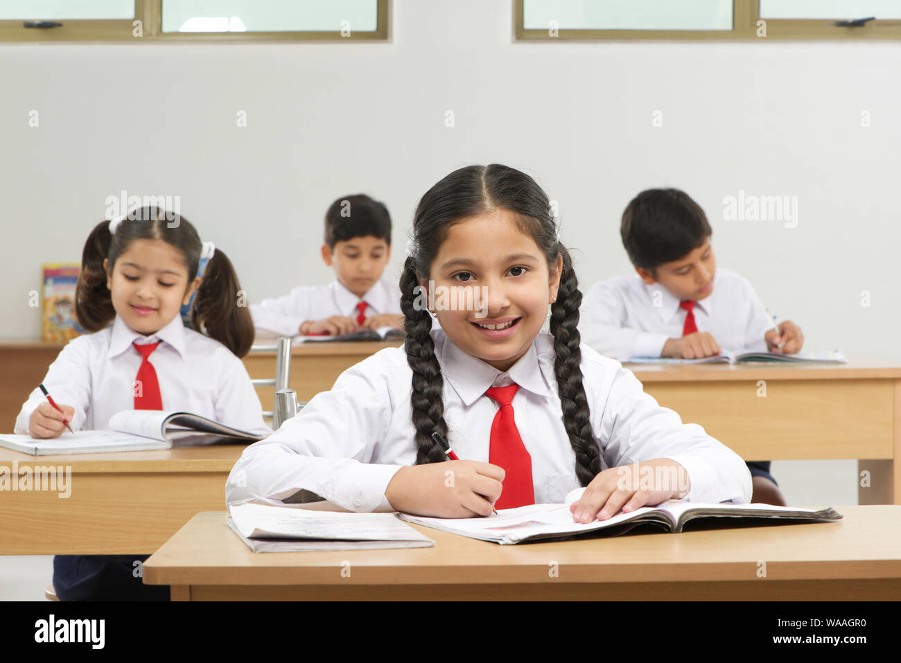 School children studying in a classroom Stock Photo - Alamy