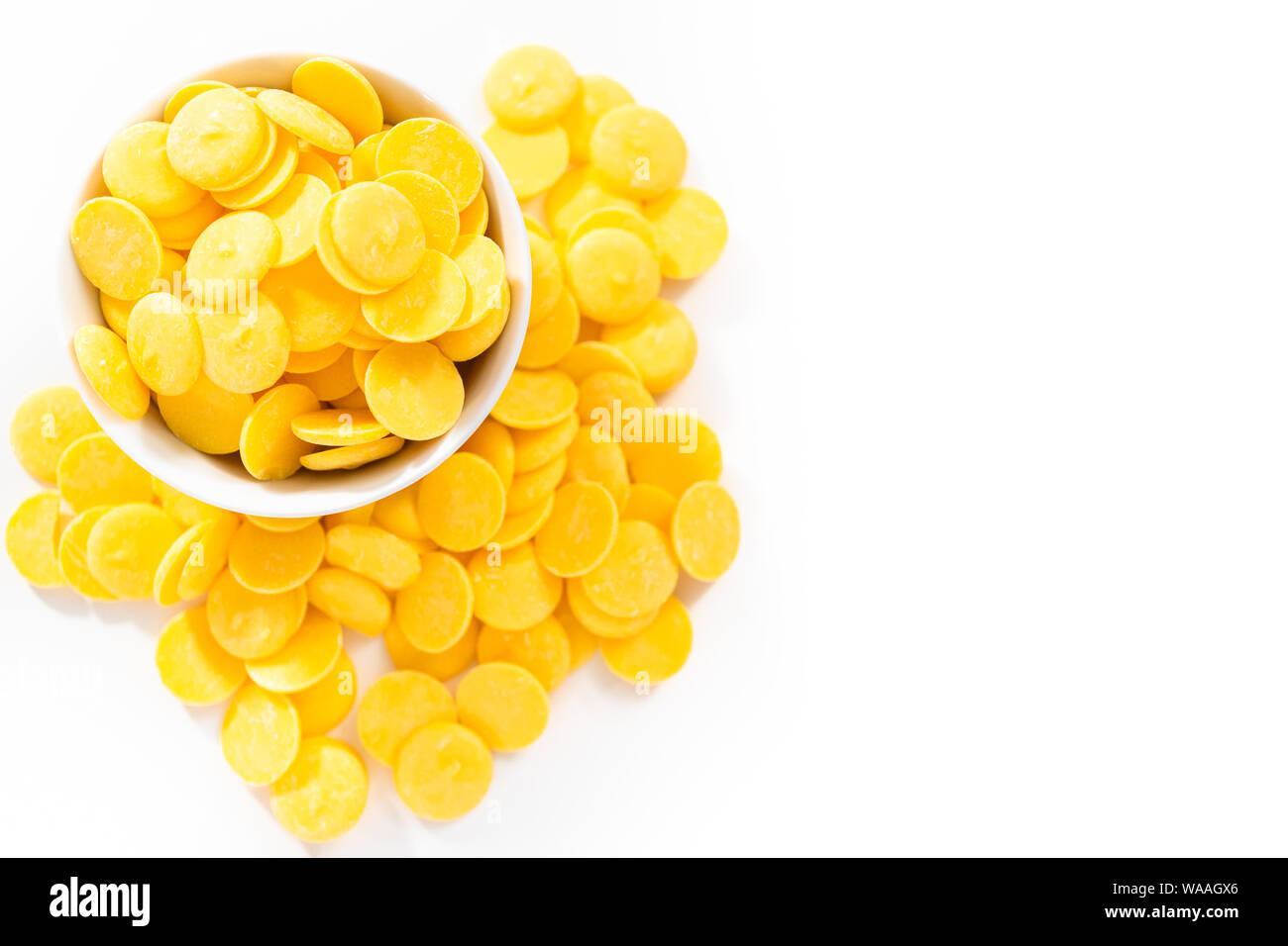 Yellow round chocolate chips for melting chocolate shapes Stock Photo ...