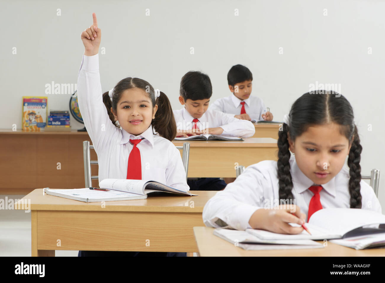 School children studying in a classroom Stock Photo - Alamy