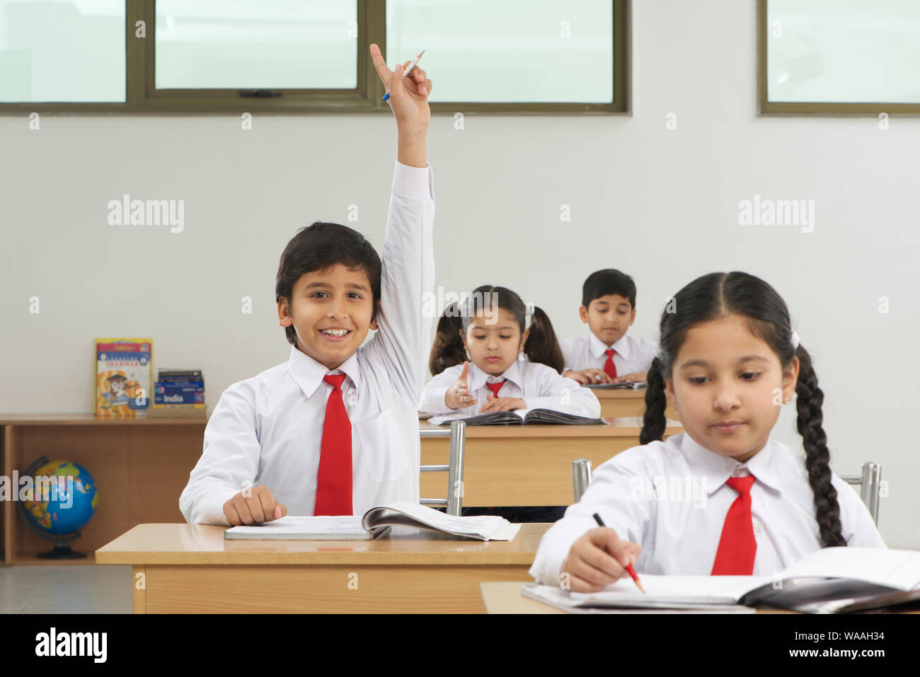 School children studying in a classroom Stock Photo - Alamy
