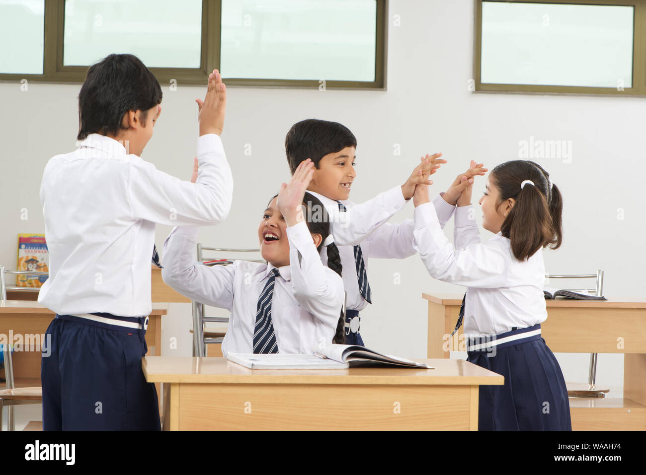 School children playing in a classroom Stock Photo - Alamy