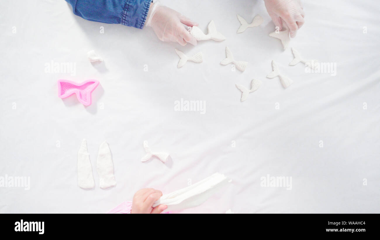 Flat lay. Step by step. Making mermaid tail from modeling clay in ...