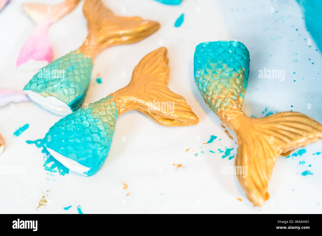 Mermaid tails made out of modeling clay and painted with acrylic paint ...