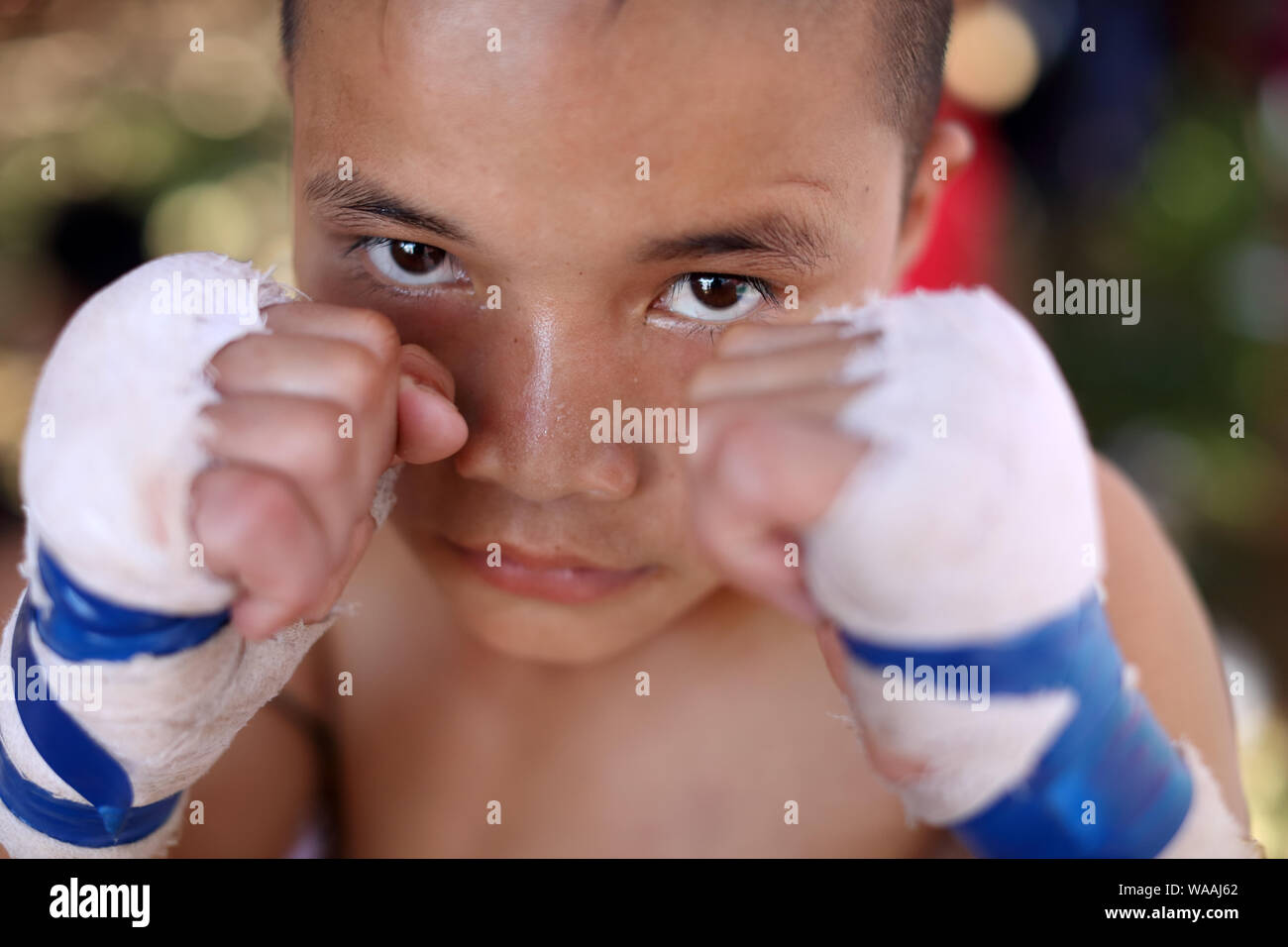 Traditional Lethwei boxer at a rural tournament in a village near Hpa ...
