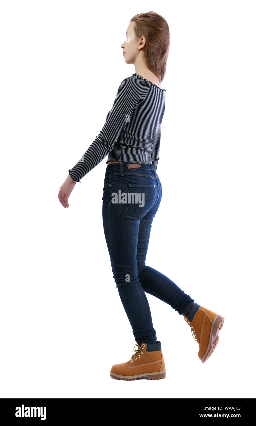 side view of walking woman. beautiful girl in motion. backside view of ...