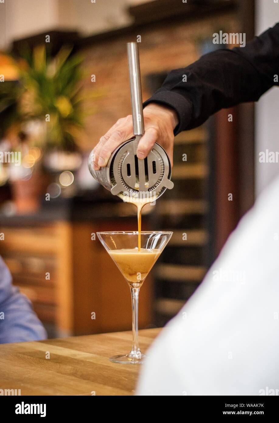 Hand pouring liquor isolated hi-res stock photography and images - Alamy