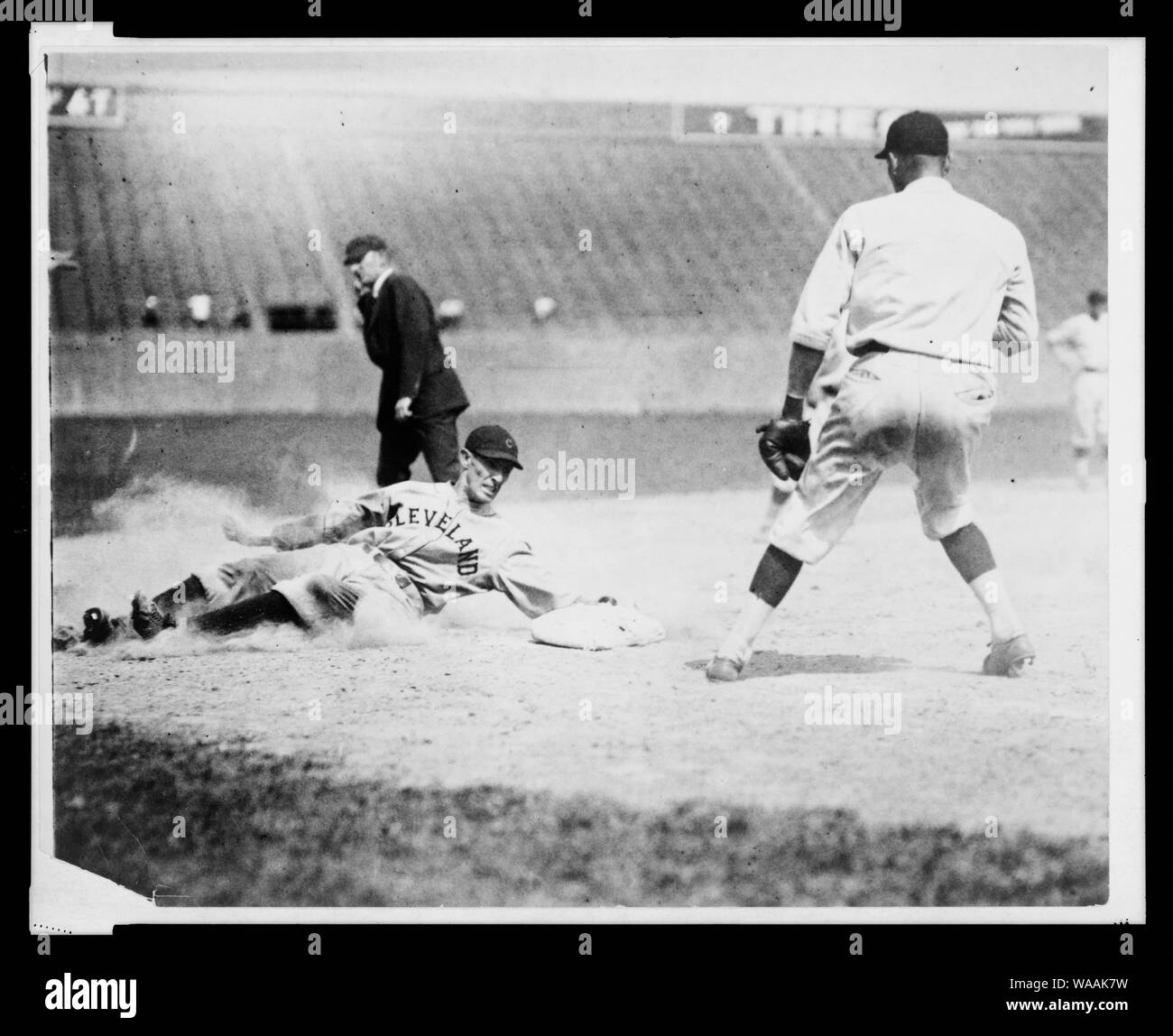 Cleveland base runner, Chick Fewster, slides safely into 3rd base ...