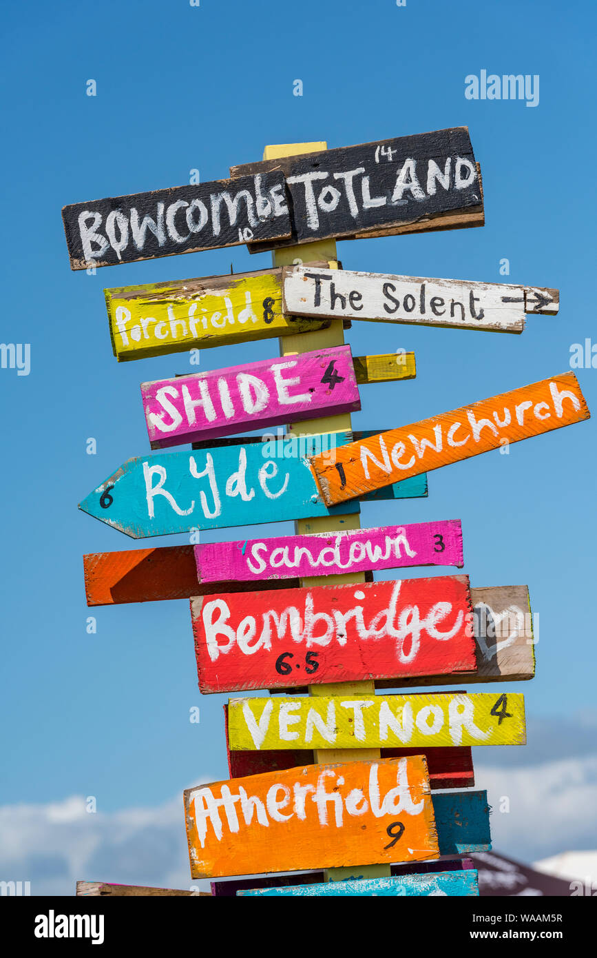 colourful painted shabby chic signpost with isle of wight place names ...