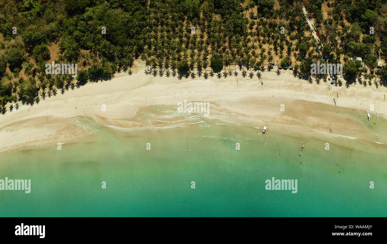 Beautiful tropical beach in cove with blue lagoon and turquoise water ...