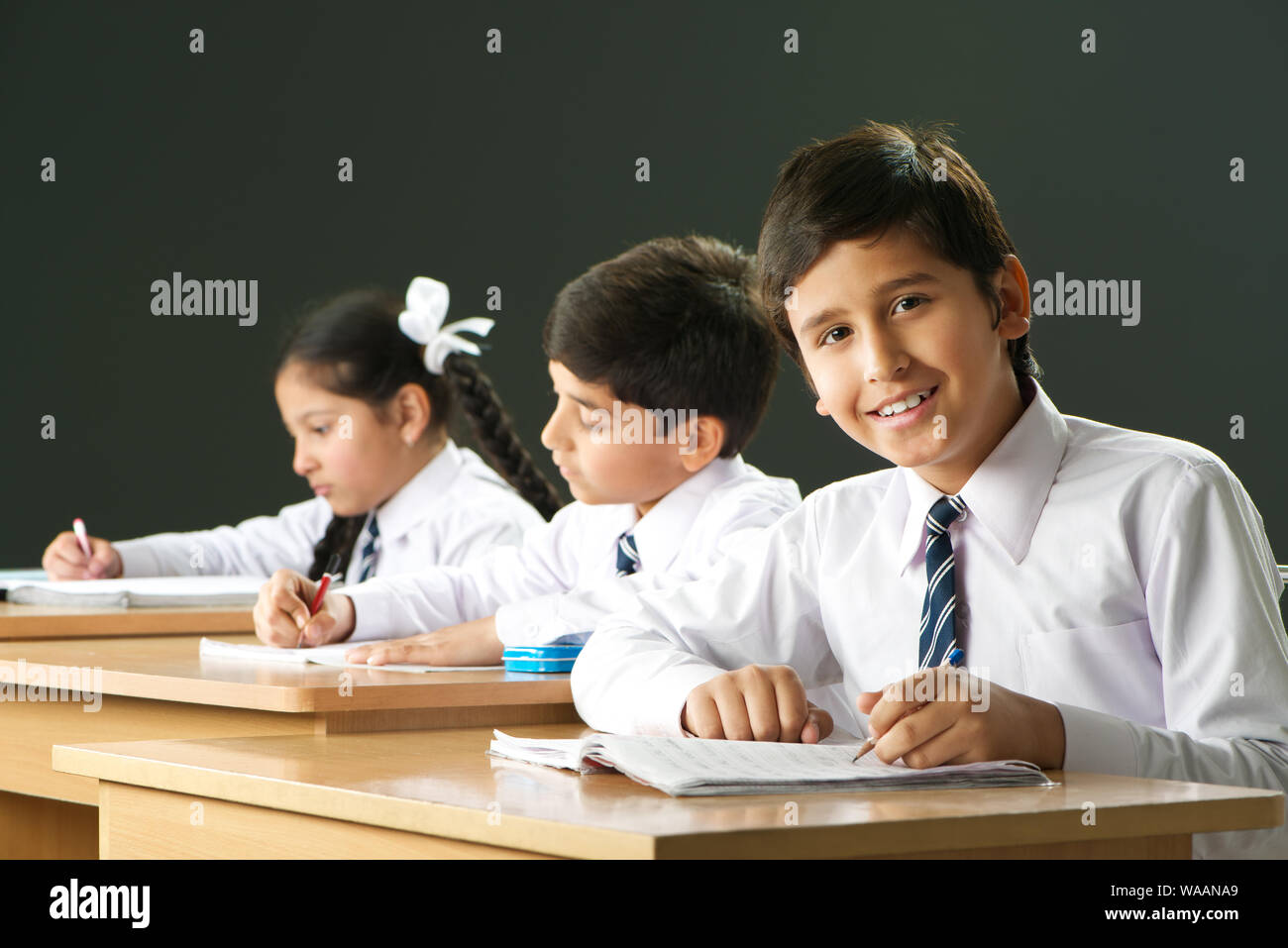 School children studying in a classroom Stock Photo - Alamy