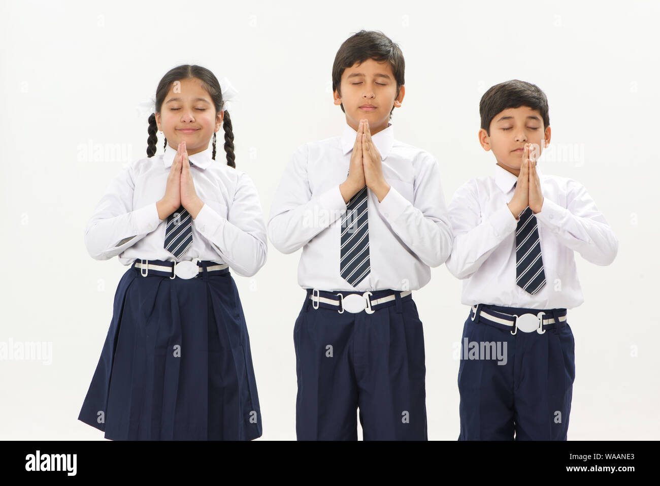 School children praying with hands joined together Stock Photo - Alamy